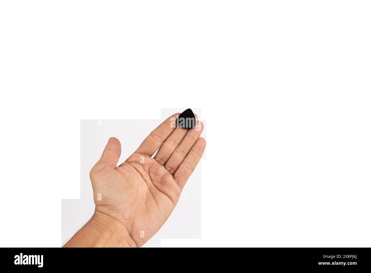 Black male hand offering a guitar pick isolated no background Stock ...