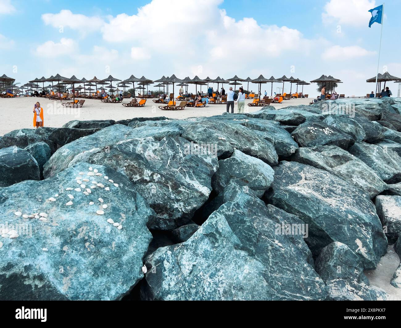 Sir Bani Yas, UAE - 5 January 2024: Visitors bask in the sun on the ...