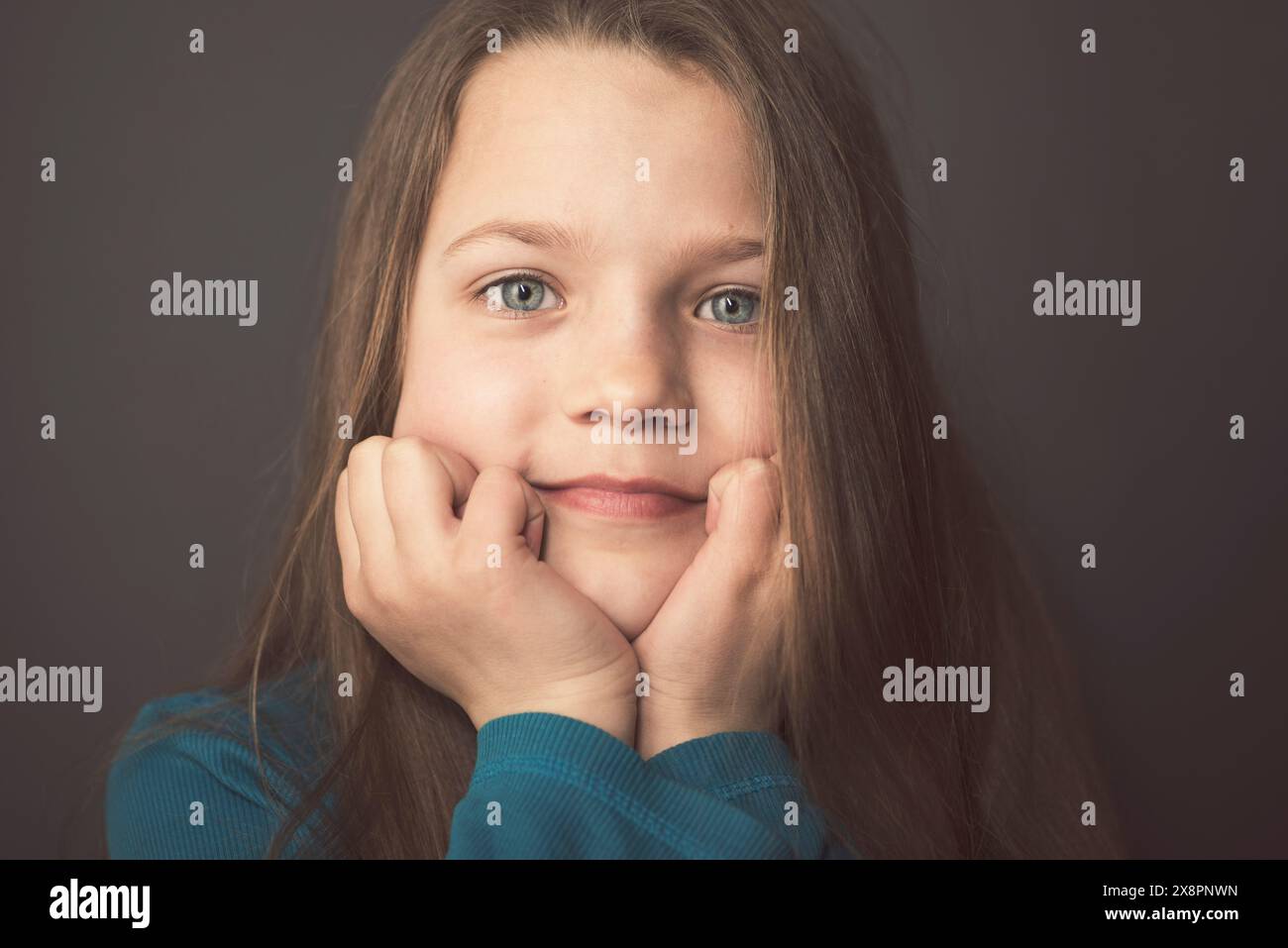 child girl studio portrait in reflective mood Stock Photo - Alamy