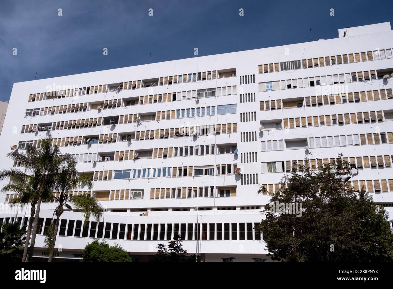 A modern residential building with white facade in Casablanca, Morocco ...
