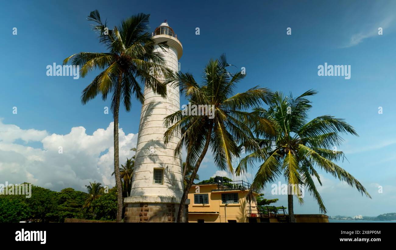 Galle Lighthouse at Galle Fort, Sri Lanka. Action. Beautiful palm trees ...
