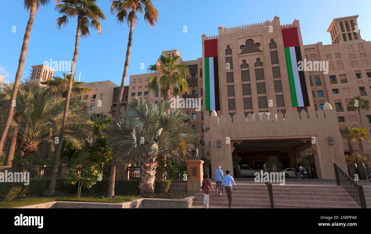 Large national flag of United Arab Emirates on a building. Action ...