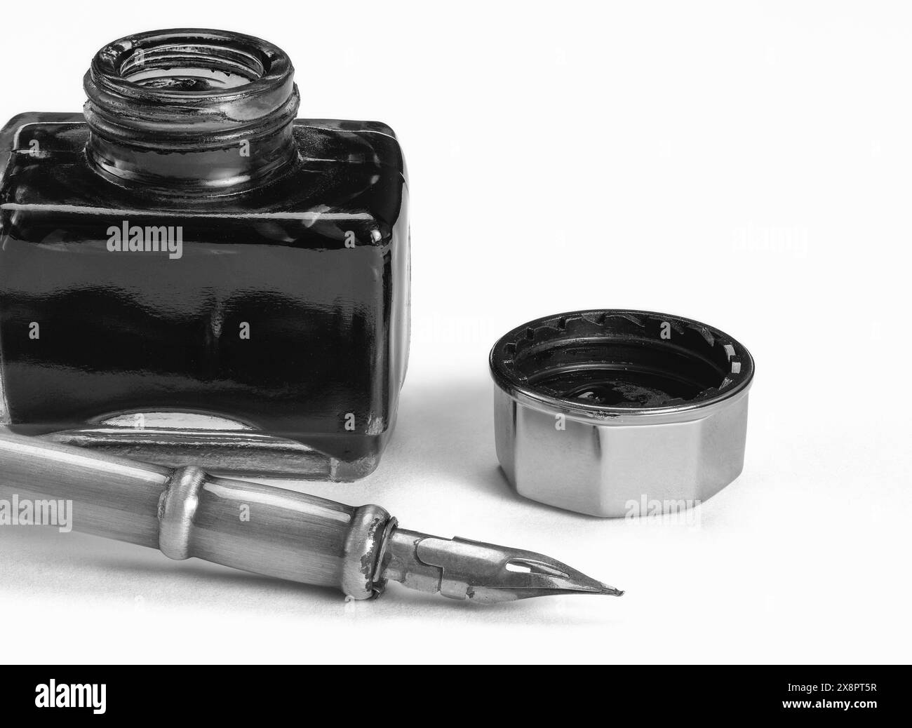 The old inkwell and quill on white background Stock Photo - Alamy