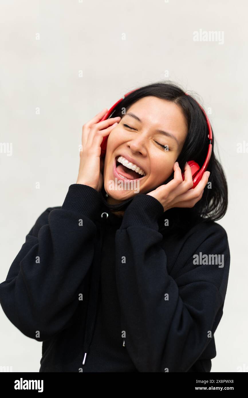 Young lively woman listening music hi-res stock photography and images ...