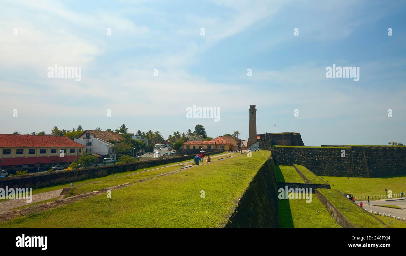 Village with ancient fortress and green grass. Action. Beautiful stone ...