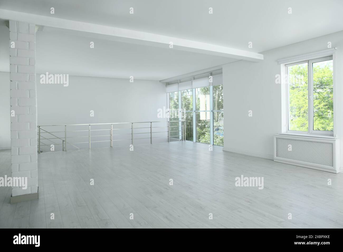 Large empty hall with windows and railings Stock Photo - Alamy