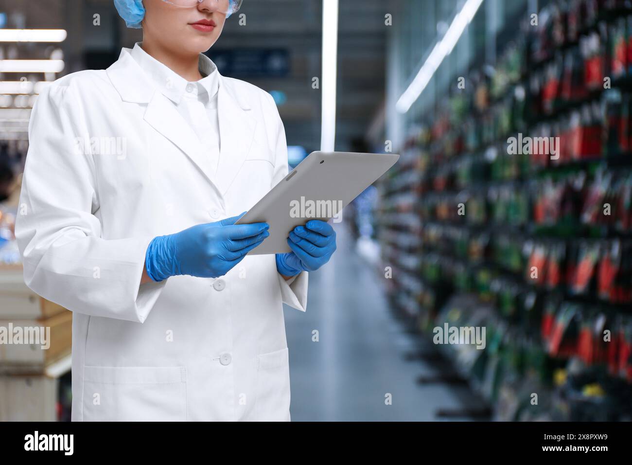 Food quality control specialist examining products in supermarket ...