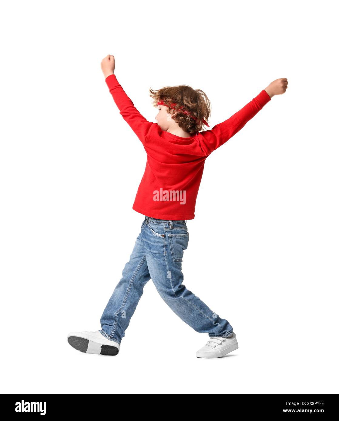 Happy little boy dancing on white background Stock Photo - Alamy
