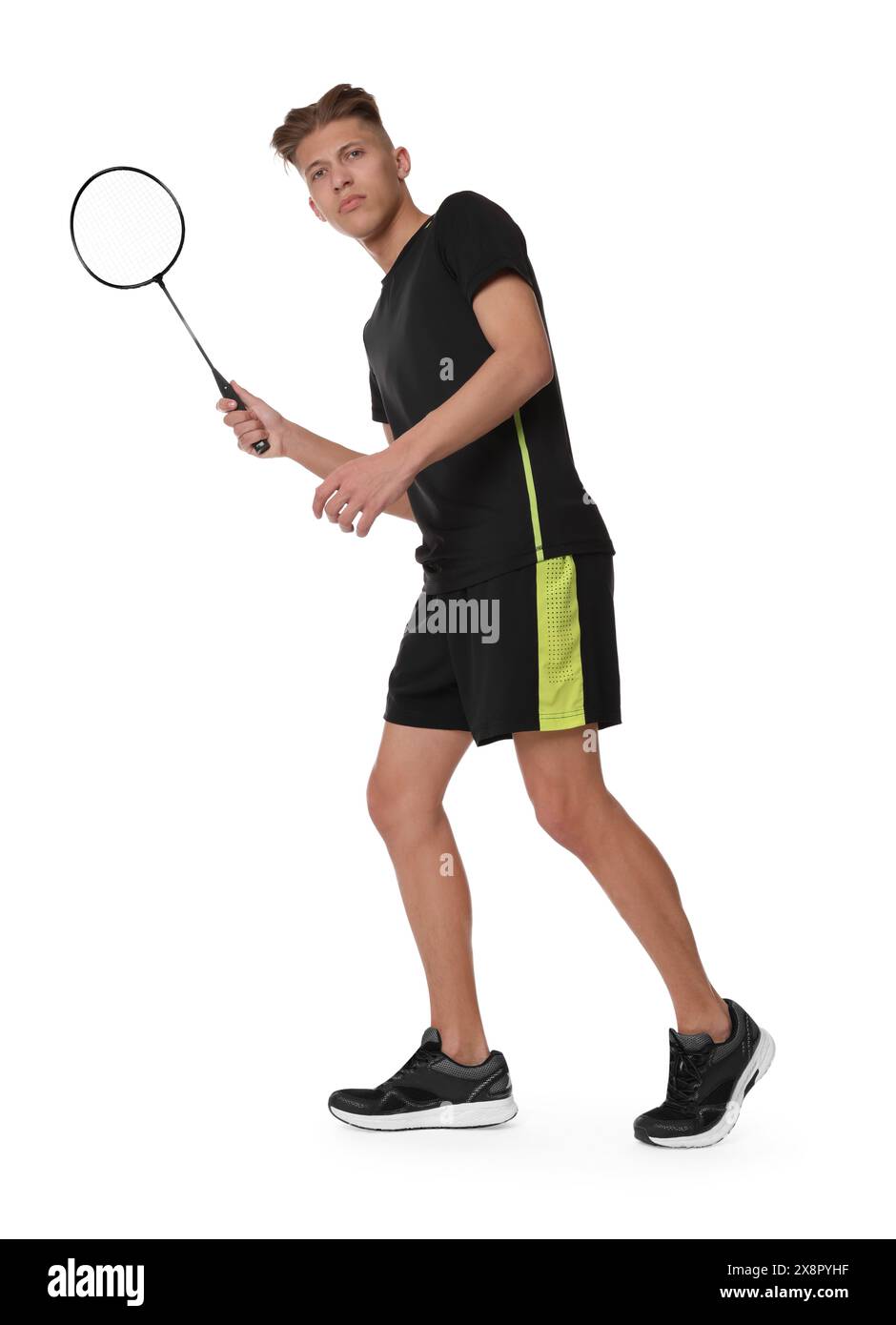Young man playing badminton with racket on white background Stock Photo ...
