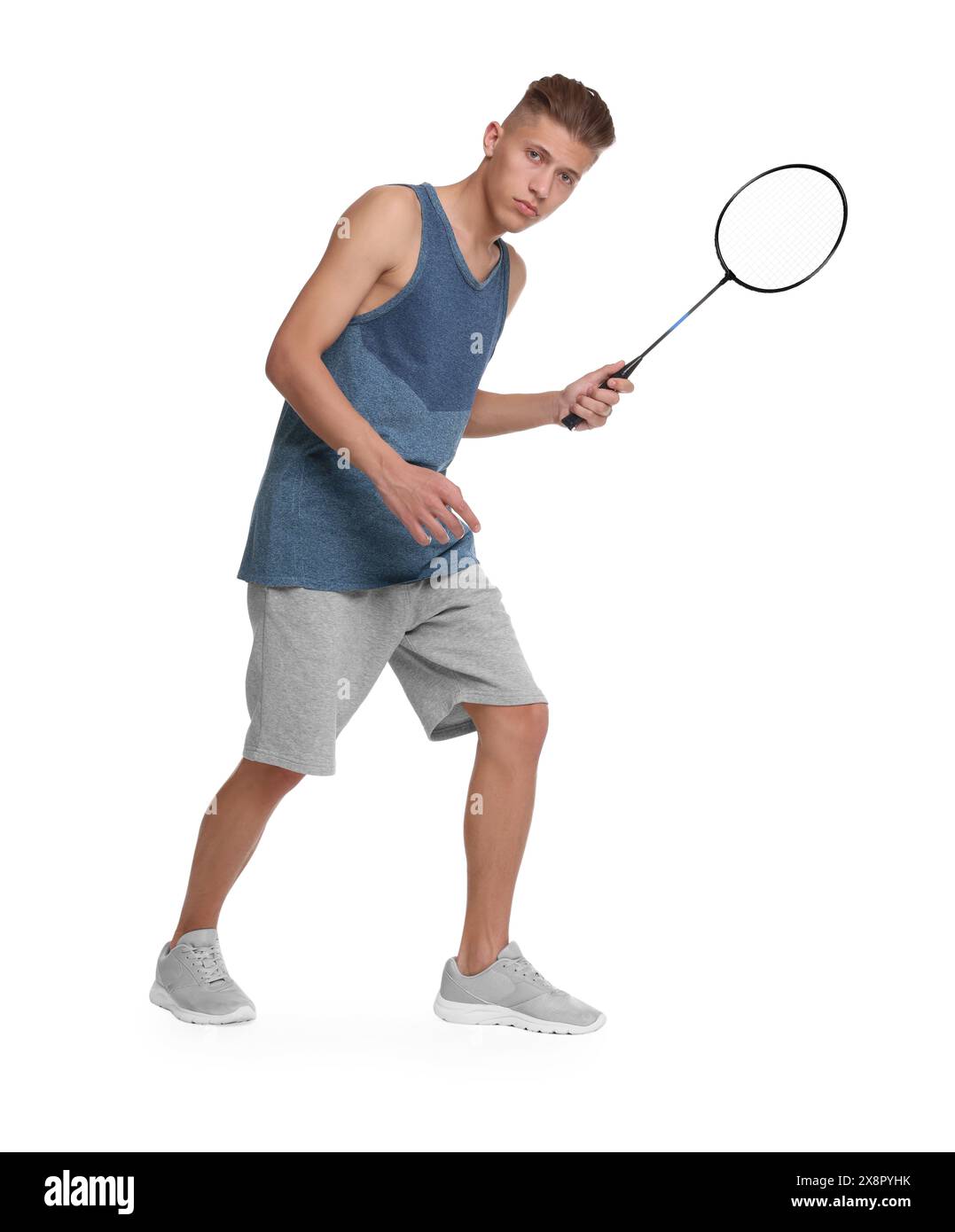 Young man playing badminton with racket on white background Stock Photo ...