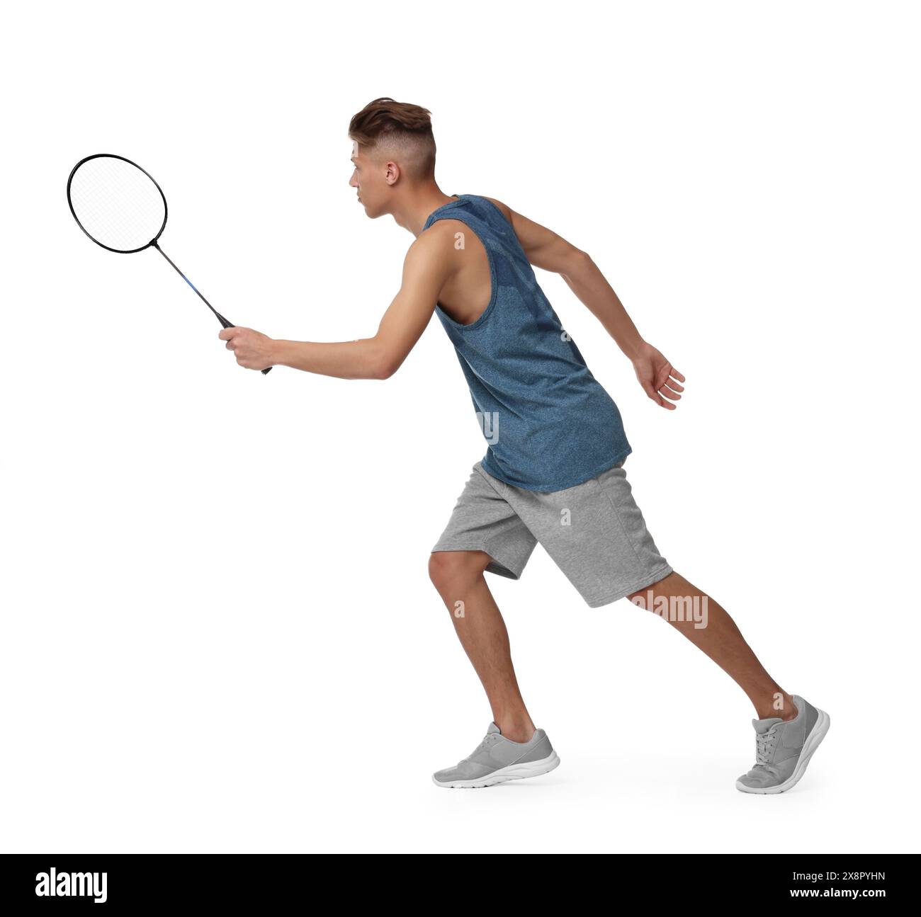 Young man playing badminton with racket on white background Stock Photo ...