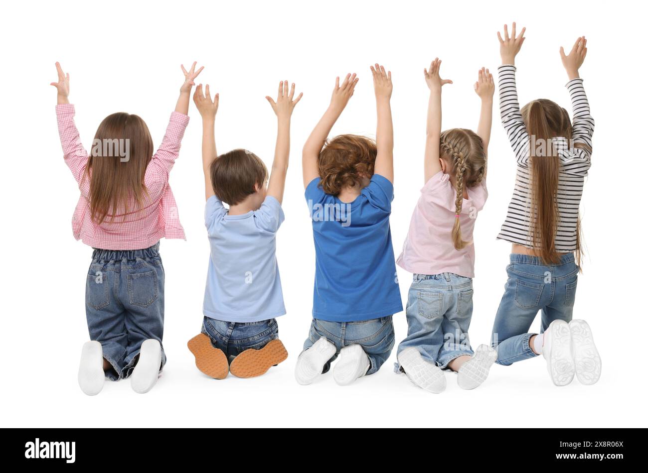 Group of children posing on white background, back view Stock Photo - Alamy
