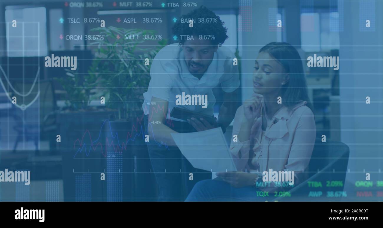 Image of graphs and trading boards over diverse coworkers sharing ideas ...