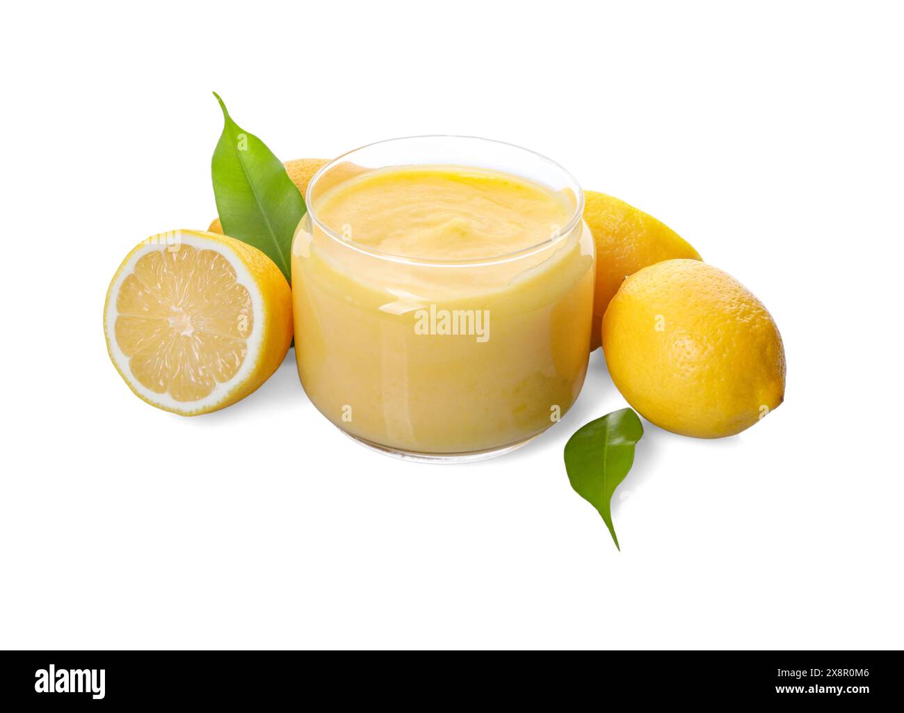 Delicious lemon curd in glass jar, fresh citrus fruits and green leaves ...