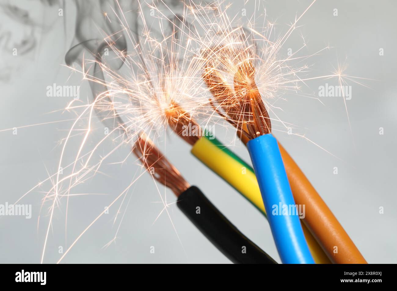 Sparking wiring on blurred background, closeup view Stock Photo - Alamy
