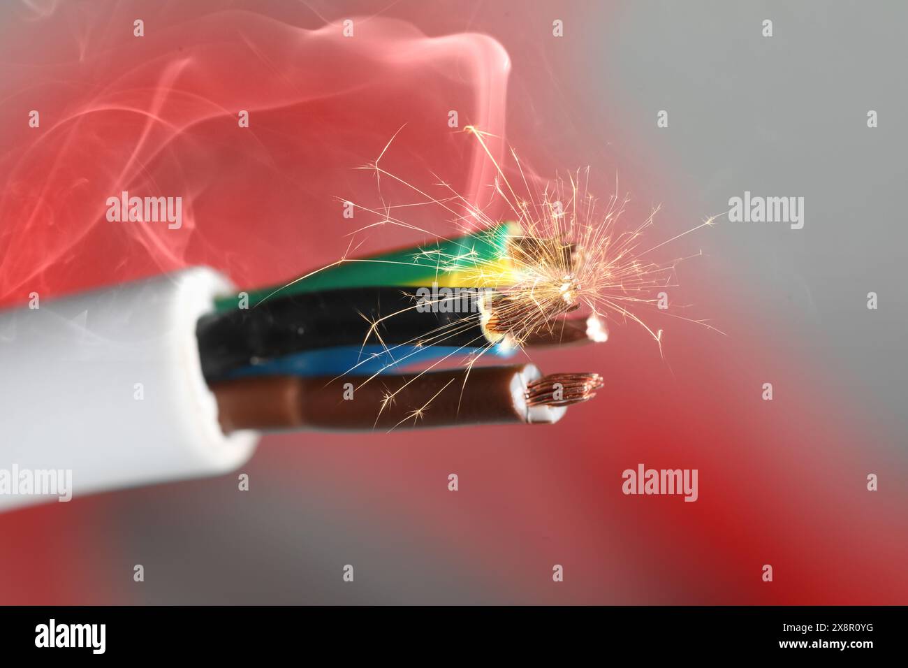 Sparking wiring on blurred background, closeup view Stock Photo - Alamy