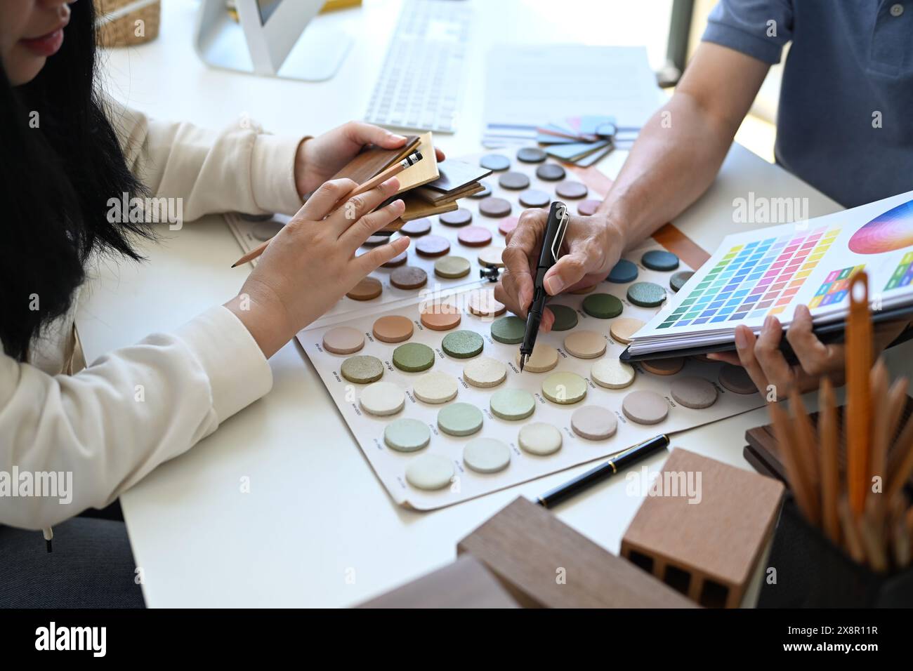 Cropped shot Interior designer helping client choosing colors in ...