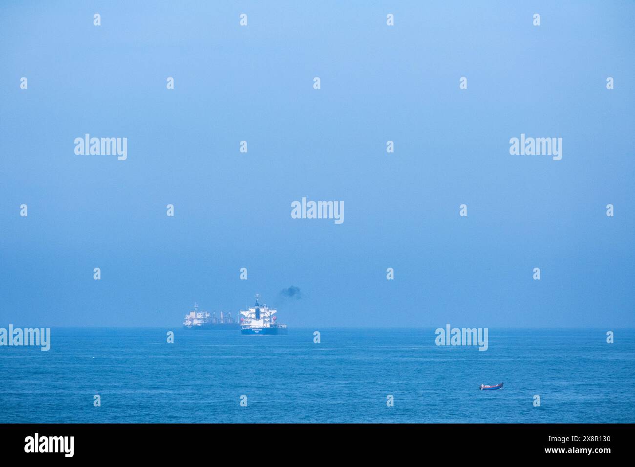 A freight ship sailing on the Atlantic Ocean near the port of ...