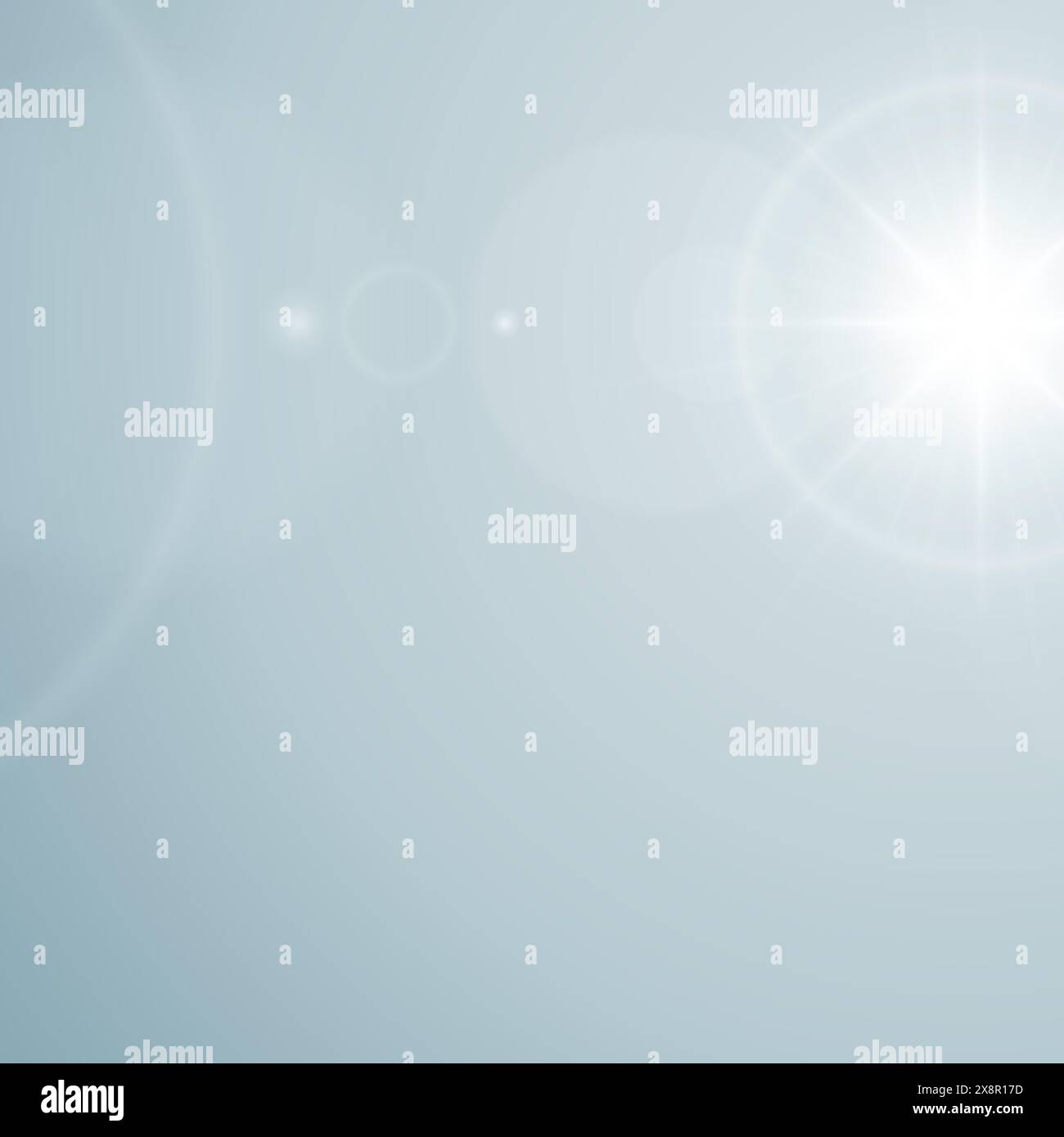 A serene blue backdrop graced with a bright lens flare creating a soft ...