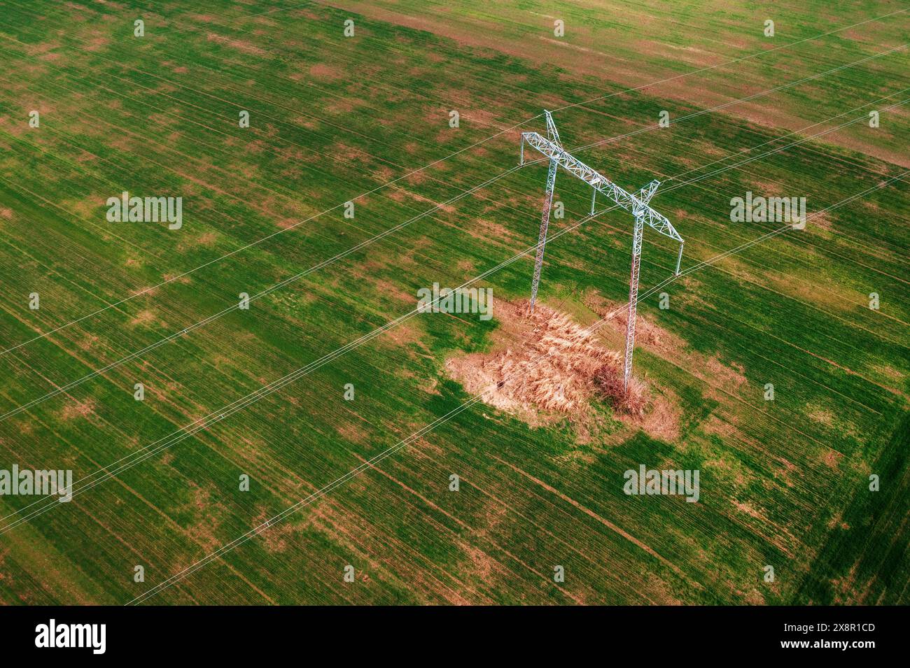 Transmission tower with four electric wires from drone point of view ...