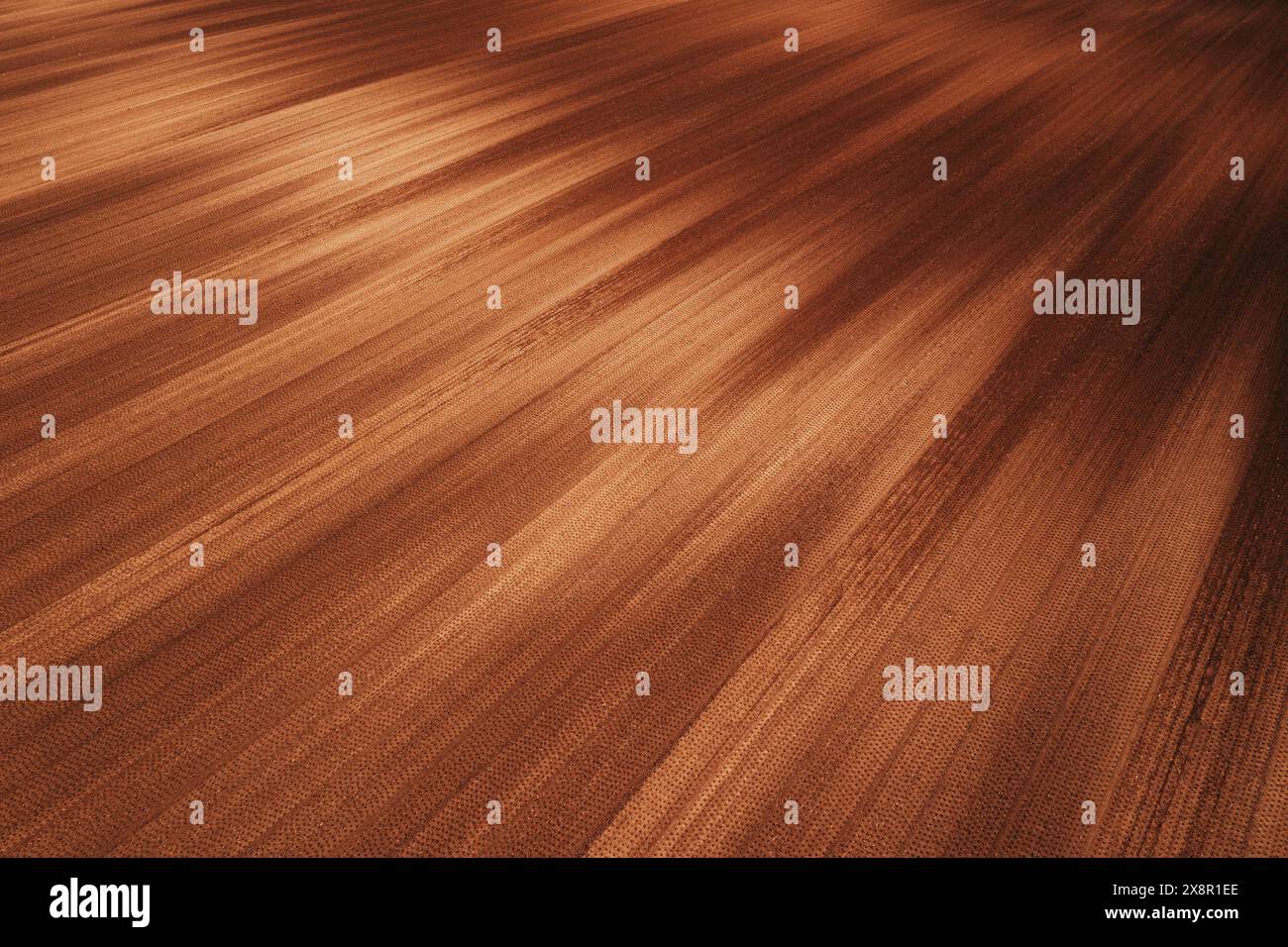 Aerial plowed field with unusual pattern seen from drone pov in spring ...