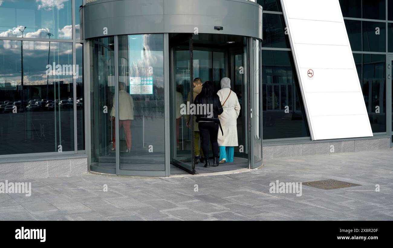 A revolving door in modern building, shopping center. Media. Glass ...