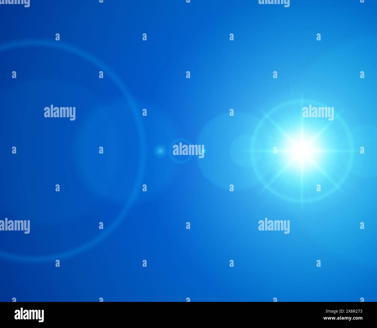 A serene blue backdrop graced with a bright lens flare creating a soft ...