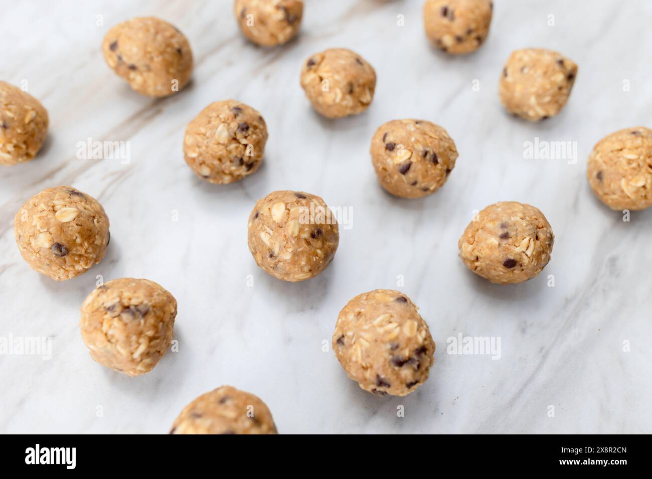 Energy balls displayed on a marble surface, oat peanut butter snacks ...