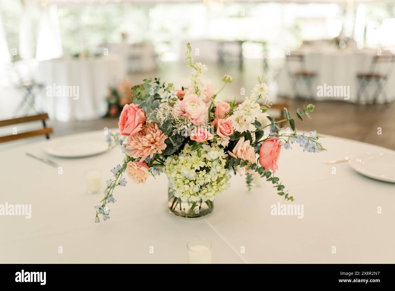 Beautiful wedding table centerpiece with a pastel floral arrangement ...