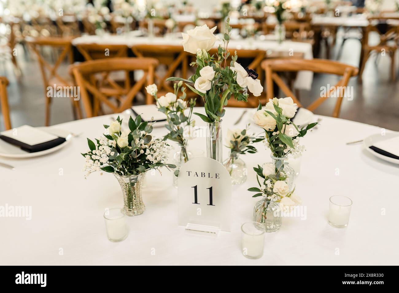 Reception table setting with numbered centerpiece Stock Photo - Alamy