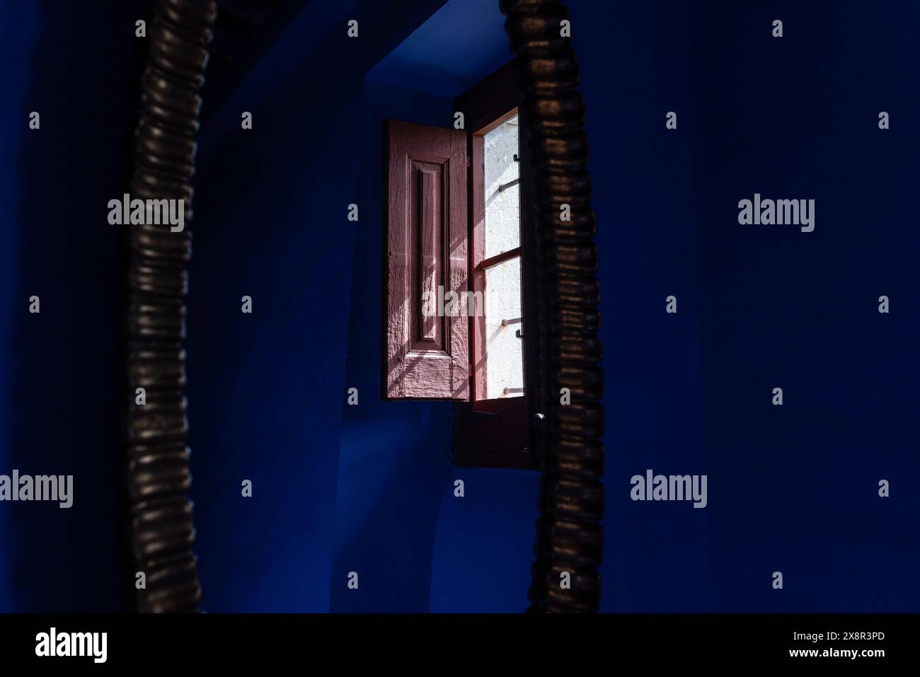 Vivid window in a shadowy blue room, with textured contrasts Stock ...