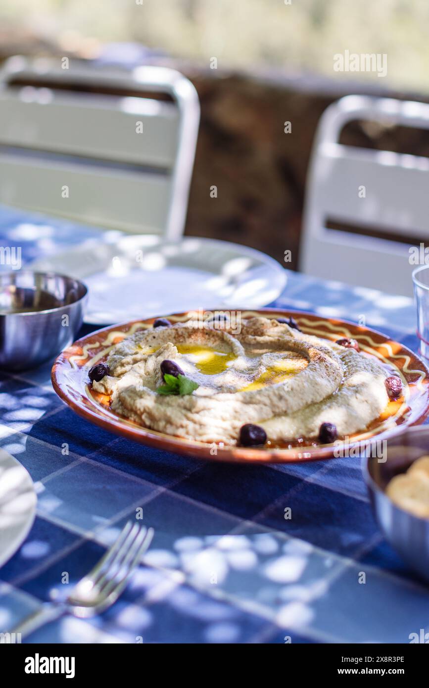 Hummus served in a garden of an old stone house in Catalonia, Spain ...