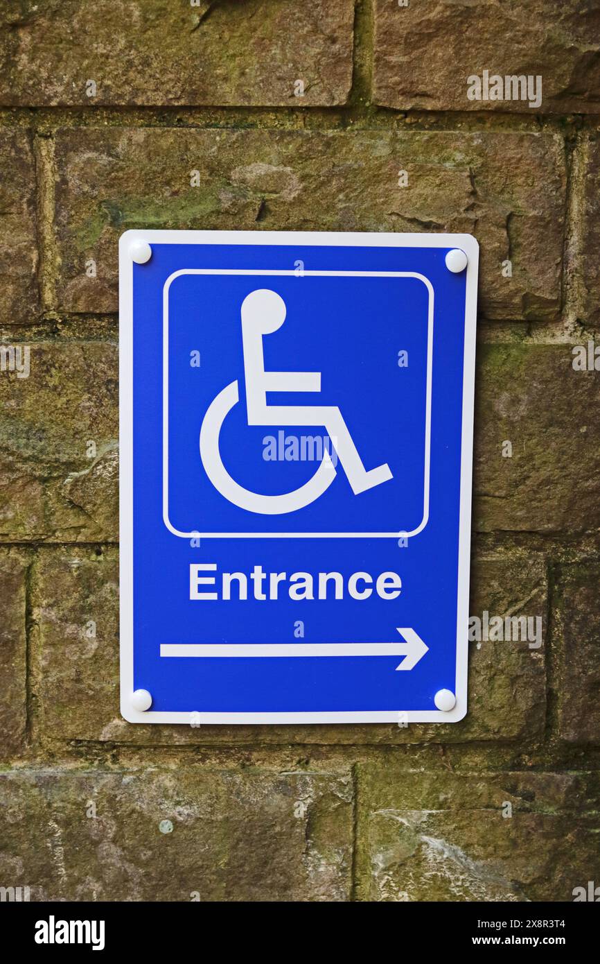 Sign showing direction of Disabled entrance Stock Photo - Alamy