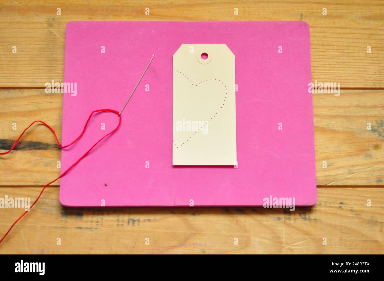 Stitching Heartfelt Gift Tags for Valentine's Day Stock Photo - Alamy