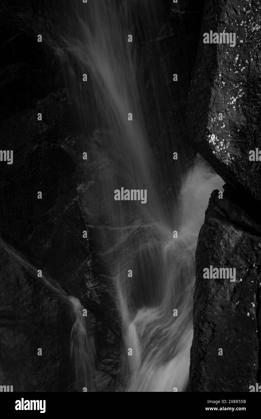 Water flows over a water fall on a creek Stock Photo - Alamy