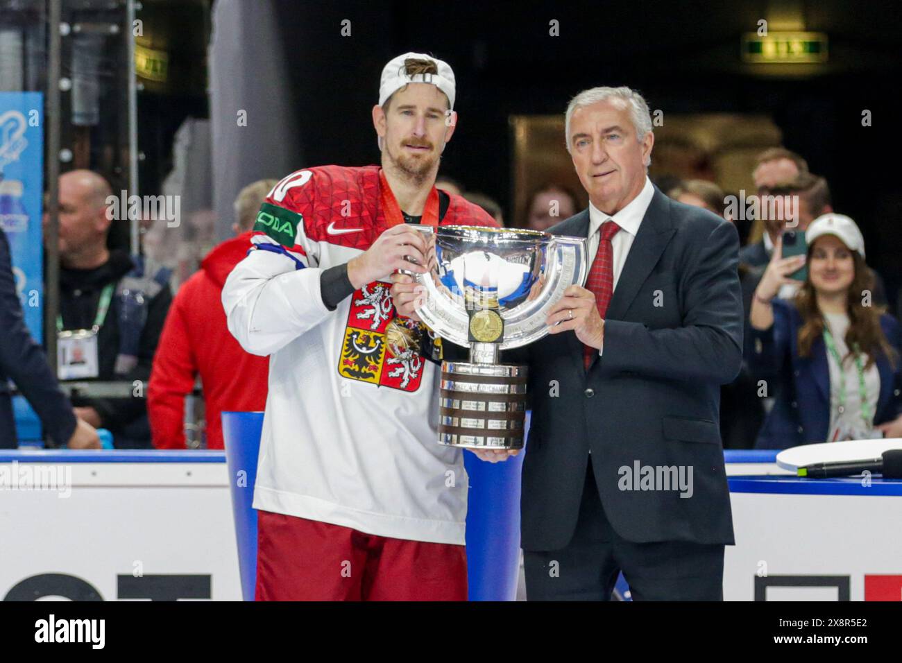 Roman Cervenka of Czechia (L) and Luc Tardif Sr (R) hold a trophy during The Medal Ceremony of ...