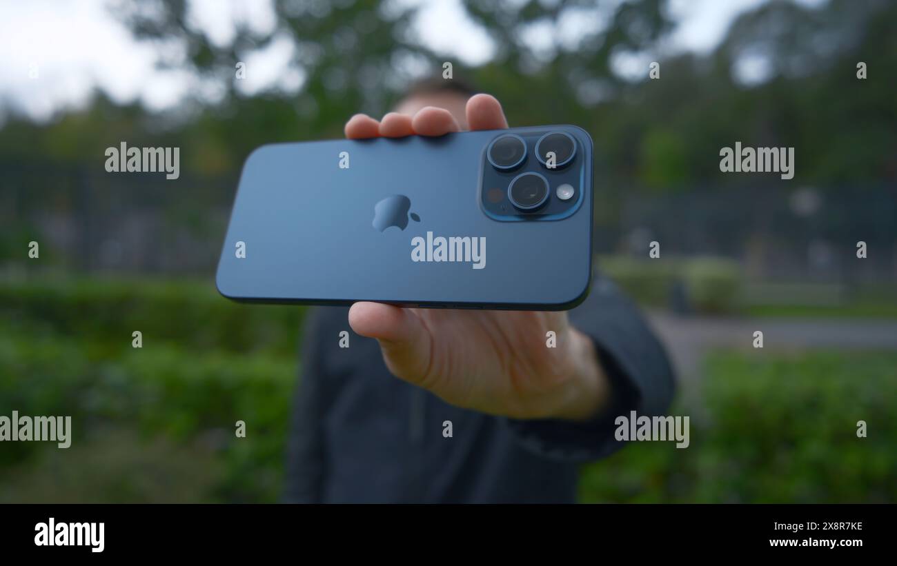 UK, London - September 15, 2023: Man takes pictures on new iPhone ...