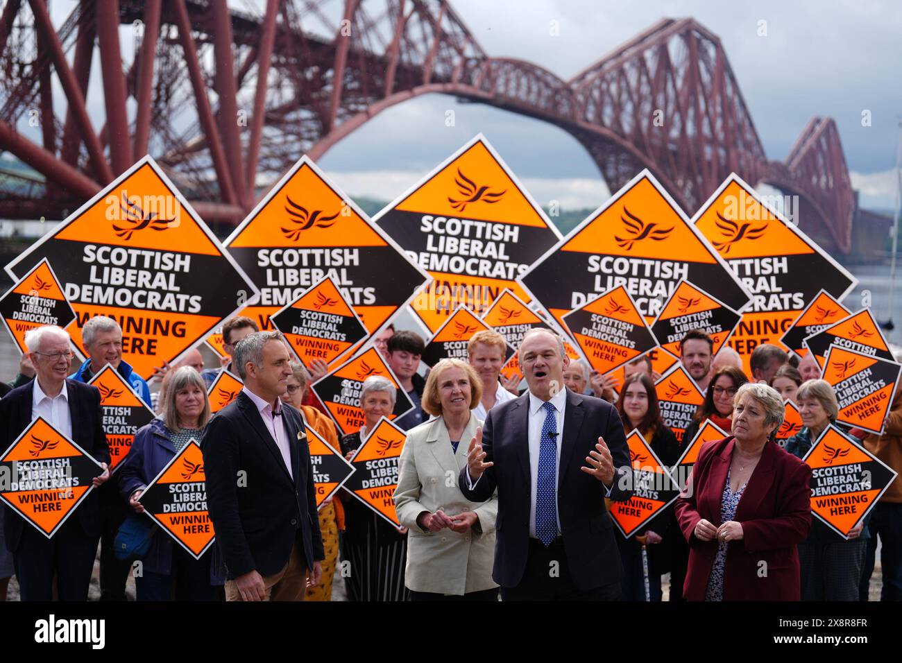 Liberal Democrat leader Sir Ed Davey stands with Alex Cole-Hamilton and ...