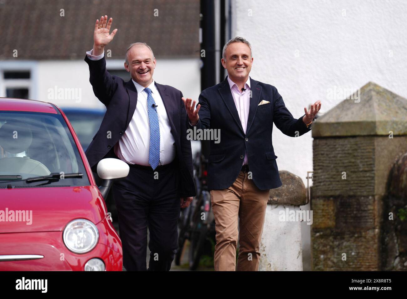 Liberal Democrat leader Sir Ed Davey (left) arrives with Alex Cole ...