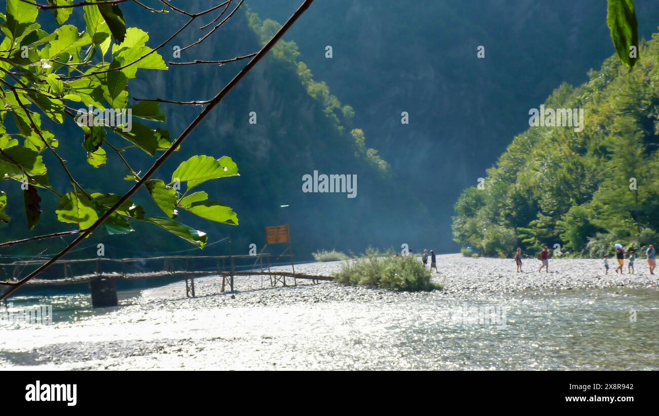 People walking on riverside Stock Photo - Alamy