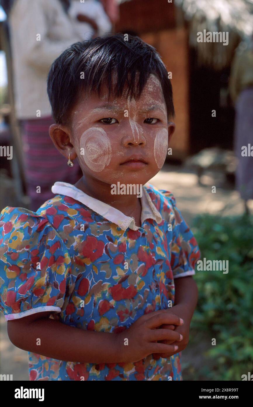 Burmese girl with thanaka paste on her cheeks hi-res stock photography ...