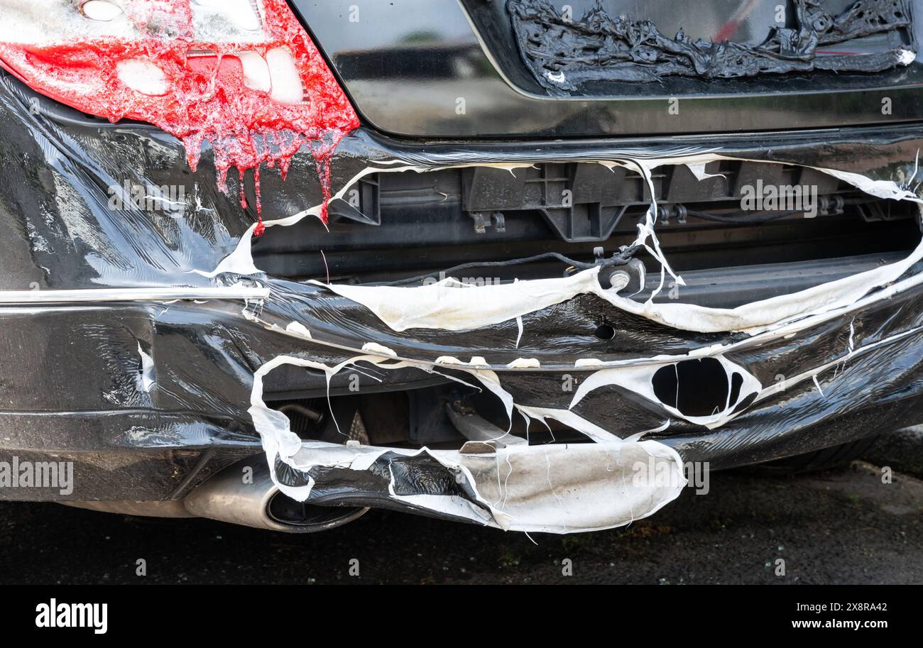 Plastic parts of the rear of a car have melted due to the heat of a car ...