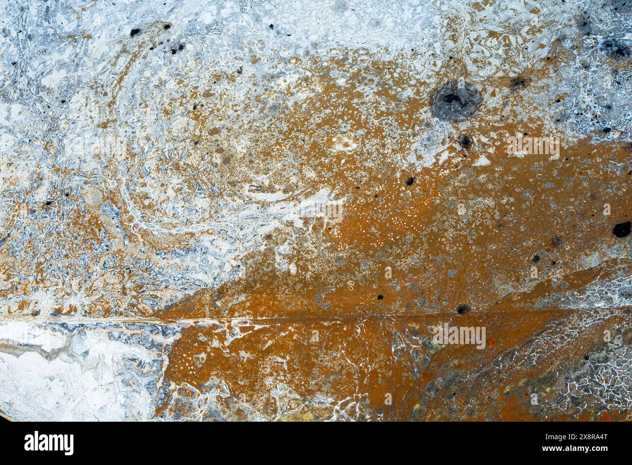 A dynamically burnt metal surface with rust bubbles and structures of ...