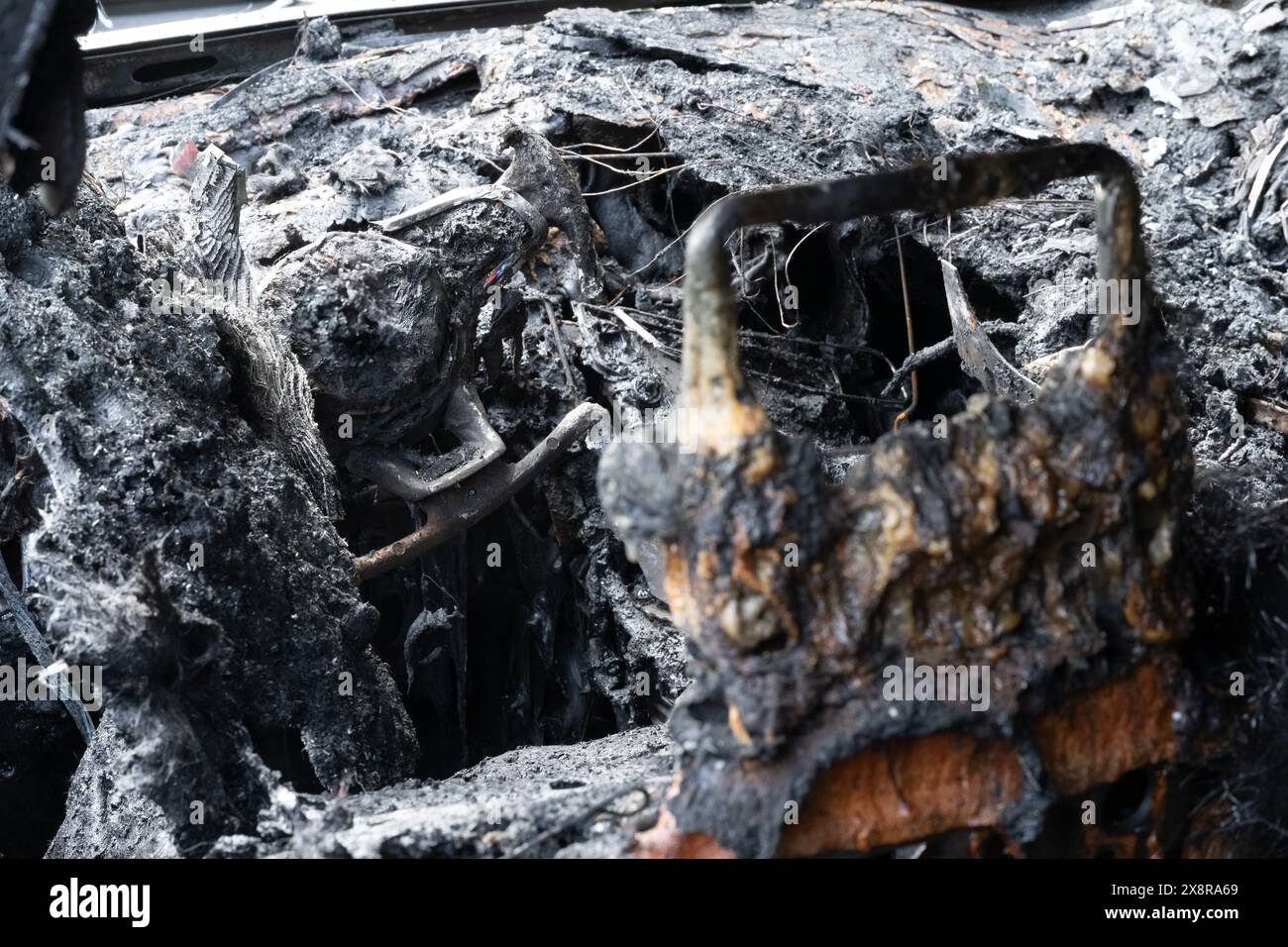 The completely burnt and melted interior of a car where you can just ...