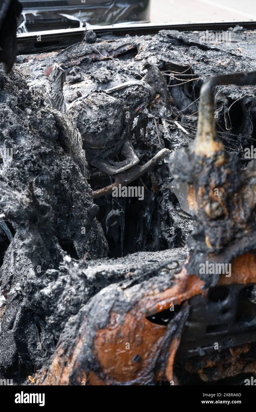 The completely burnt and melted interior of a car where you can just ...