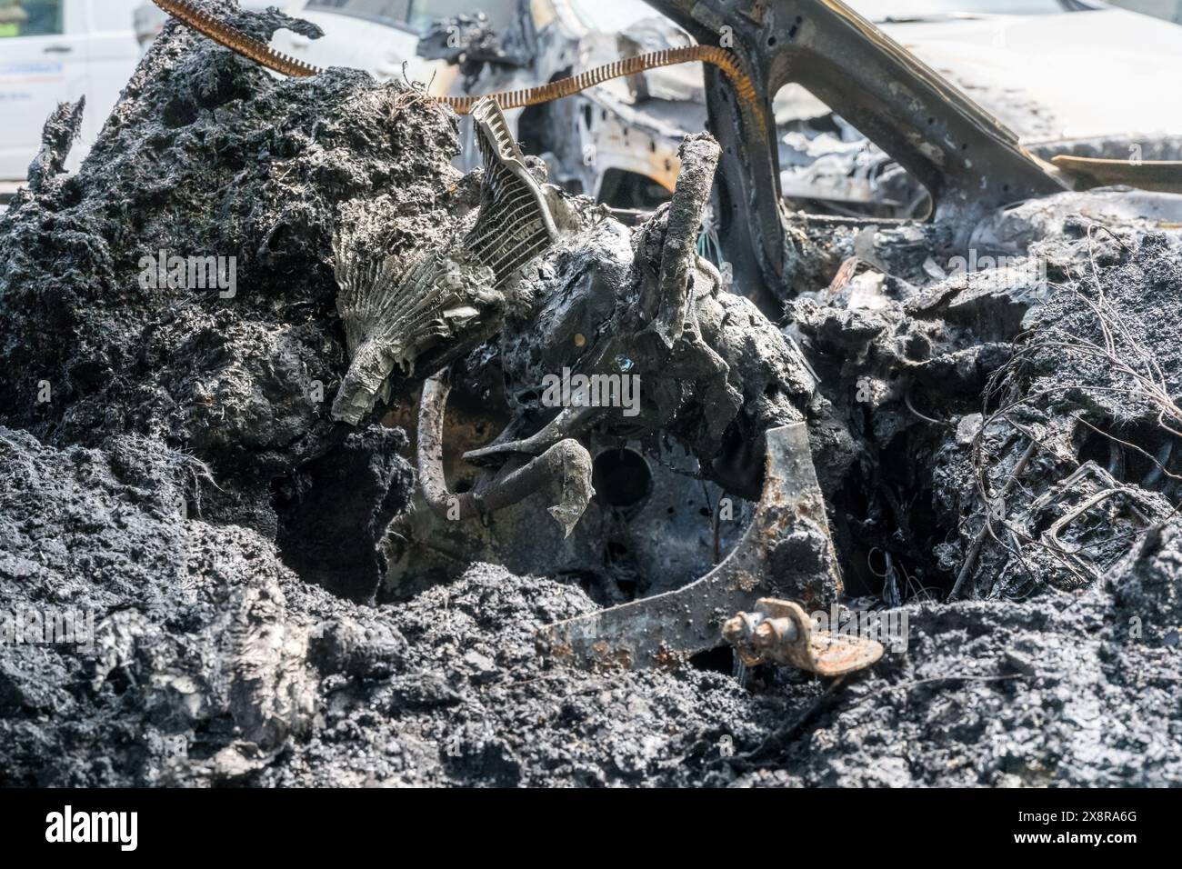 The completely burnt and melted interior of a car where you can just ...