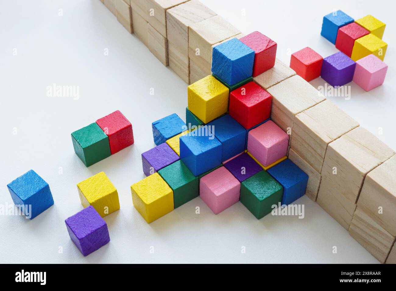 Colored cubes overcome an obstacle in the form of a wall. Creativity or ...