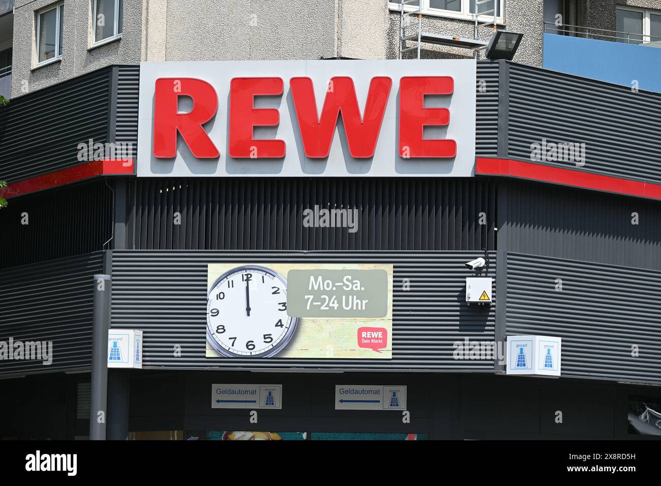 Cologne, Germany. 20th May, 2024. Entrance to a REWE supermarket branch ...