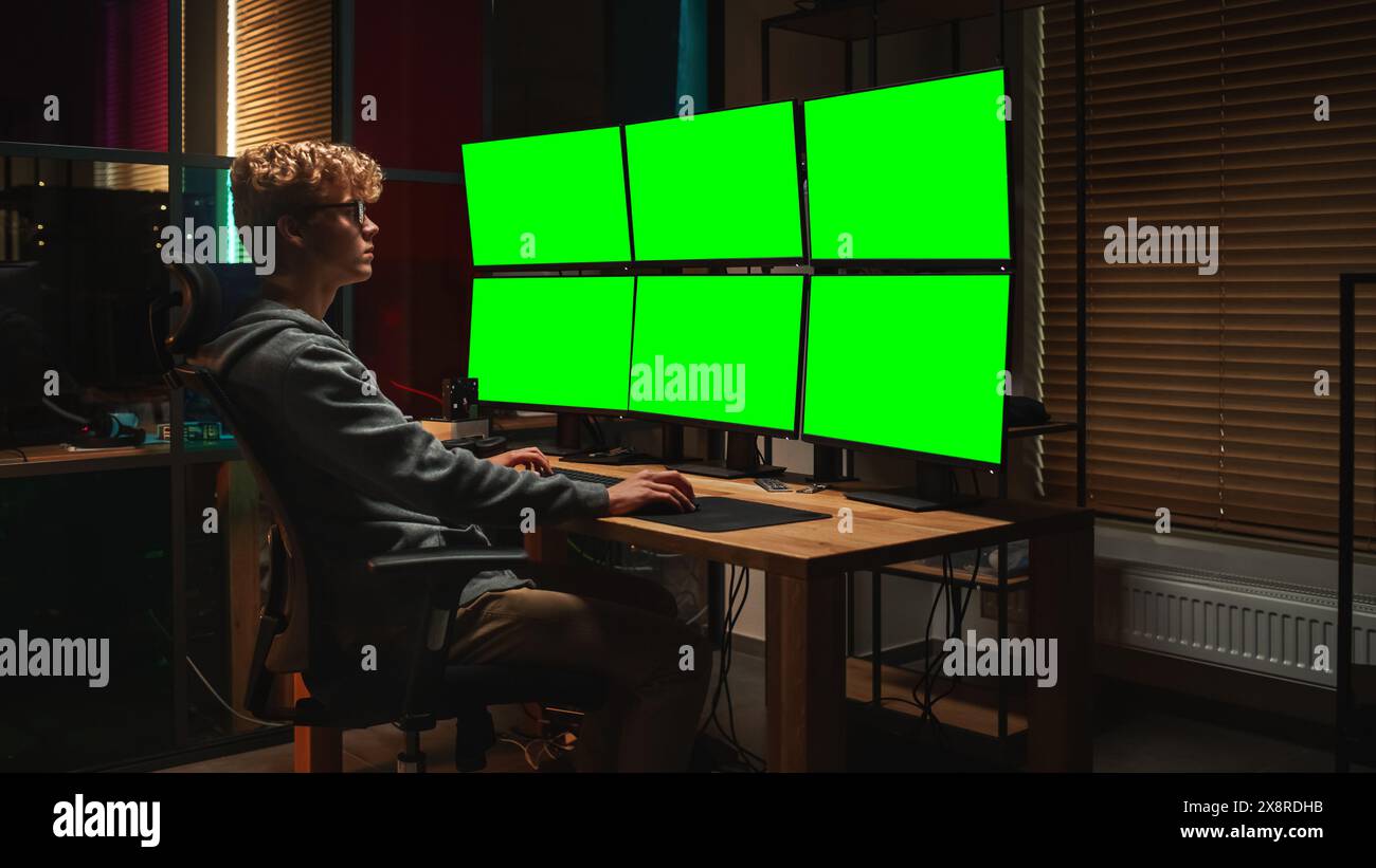 Young Caucasian Man Writing Code on Professional Six Monitors Setup ...