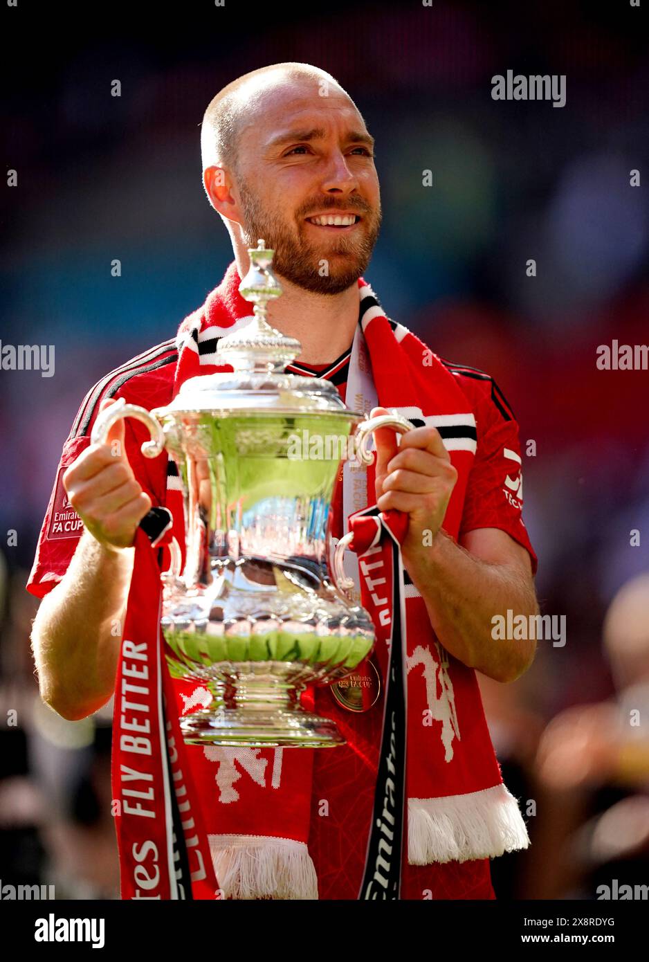 Manchester United's Christian Eriksen celebrates with the trophy after ...